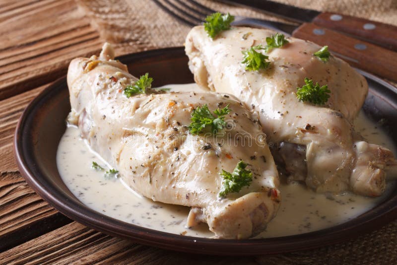 Rabbit Leg Cooked in Cream Close Up on a Plate. Horizontal Stock Image ...