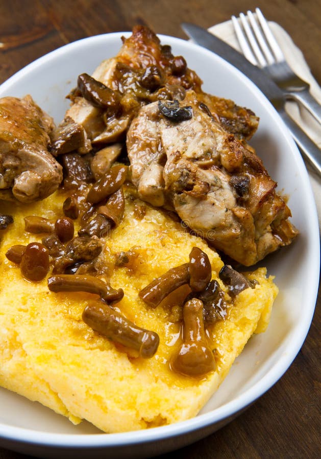 Rabbit with Mushrooms and Polenta Stock Photo - Image of mushrooms ...
