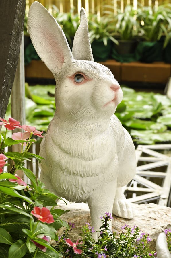 Rabbit sculpture in garden stock photo. Image of garden - 46667660