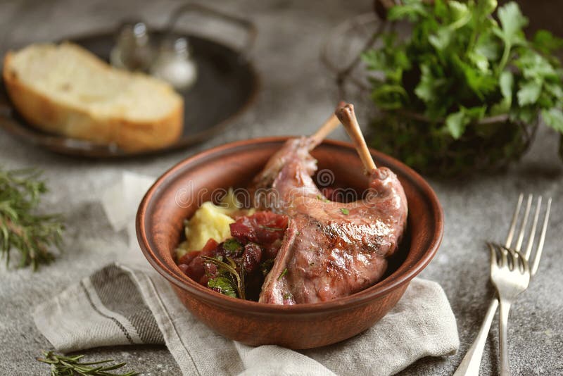 Rabbit Stewed in Wine with Vegetables, Rosemary and Cherry. Stock Image ...
