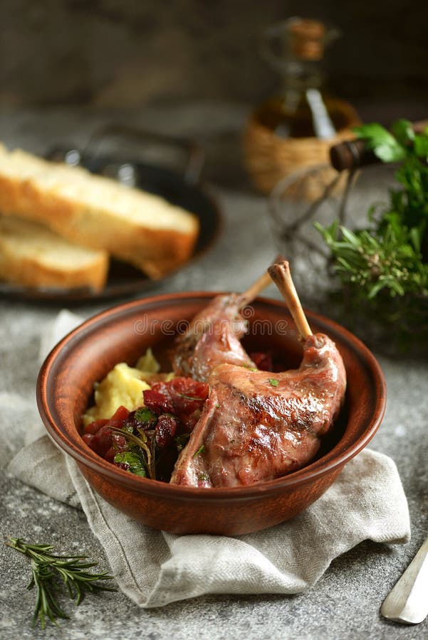 Rabbit Stewed in Wine with Vegetables, Rosemary and Cherry. Stock Image ...