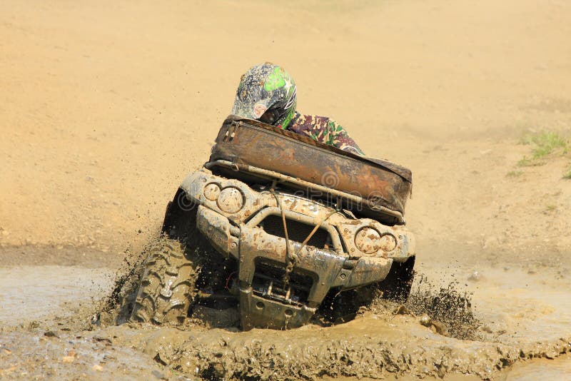 Race Four-wheeler in a Puddle of Mud Editorial Stock Photo - Image of ...