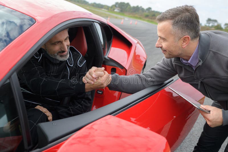 Race Pilot and Engineer Shaking Hands on Race Track Stock Image - Image ...