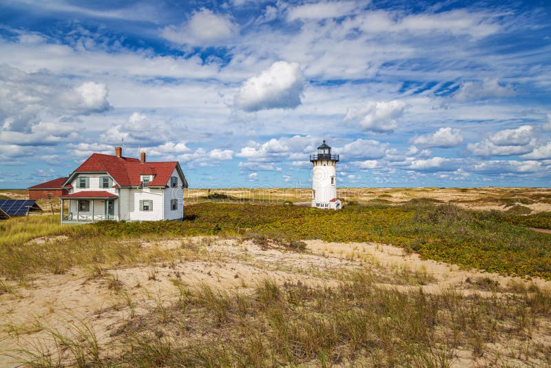 Race Point Lighthouse in Cape Cod Stock Image - Image of clouds, green ...