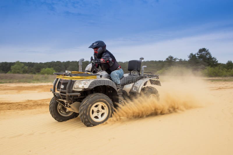 Racing ATV is sand. stock image. Image of race, dunes - 74242167