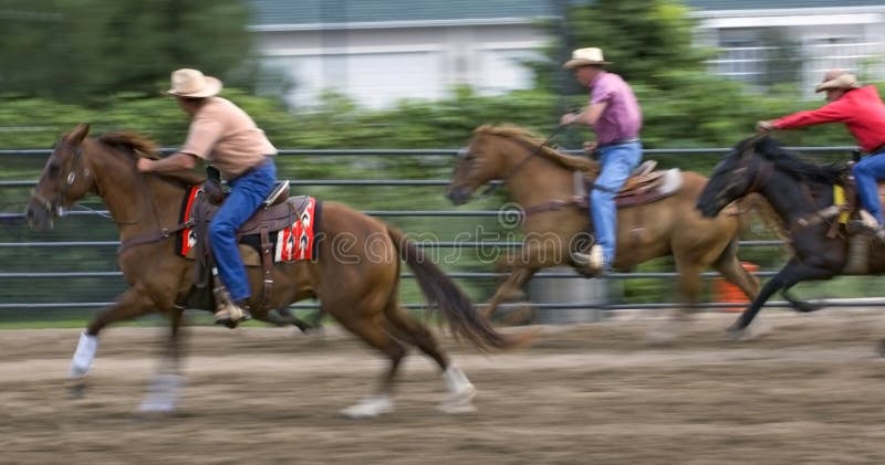 Racing Cowboys at Rodeo Panning and Motion Blur Stock Photo - Image of ...