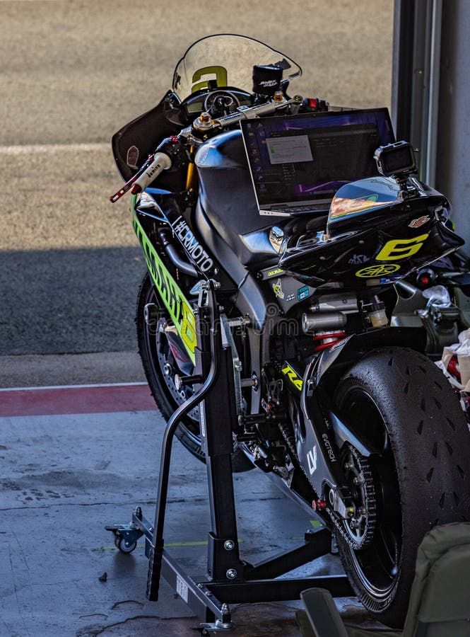 Racing Motorcycle with Laptop in Garage for Tuning. Editorial ...