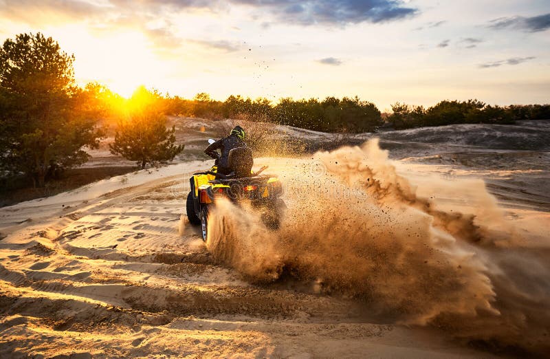 Racing in the Sand on a Four-wheel Drive Quad Stock Image - Image of ...