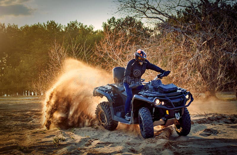 Racing Powerful Quad Bike on the Difficult Sand in the Summer Stock ...