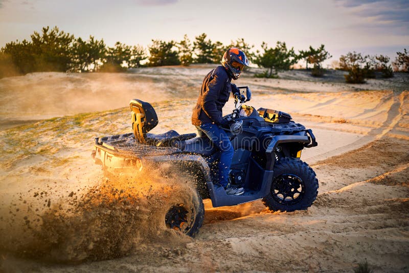 Racing Powerful Quad Bike on the Difficult Sand in the Summer Stock ...