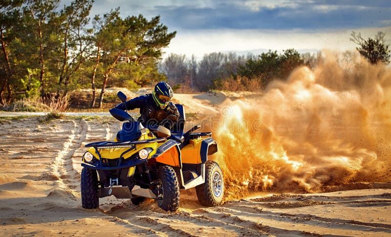 Racing in the Sand on a Four-wheel Drive Quad Stock Image - Image of ...
