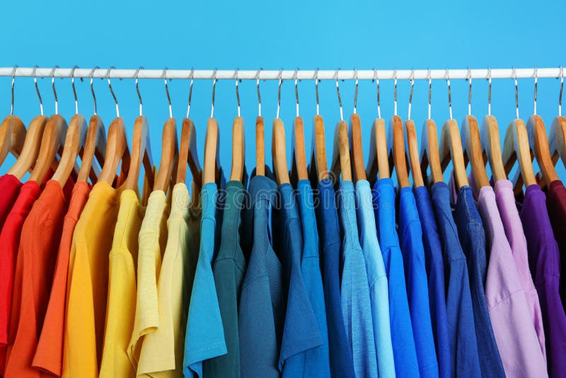 Rack With Bright Clothes On White Background Stock Image - Image of ...