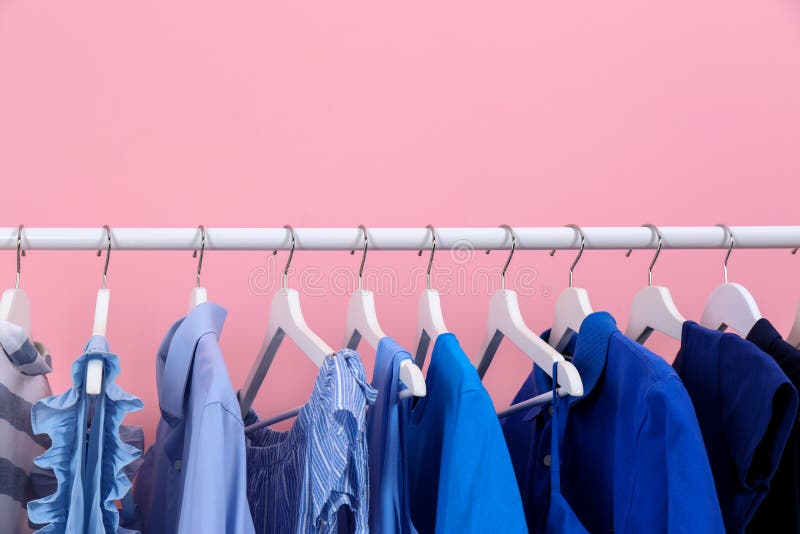 Rack with Bright Clothes on Background. Rainbow Colors Stock Image ...