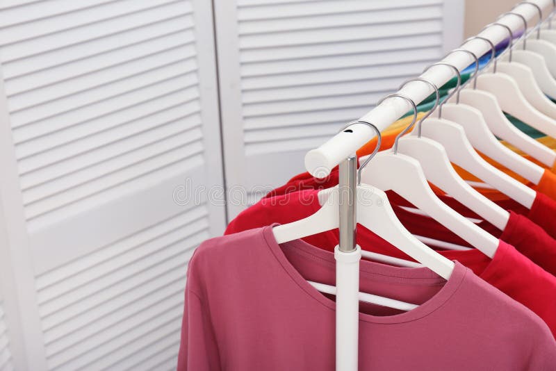 Rack with Bright Clothes in Room Stock Image - Image of closeup ...