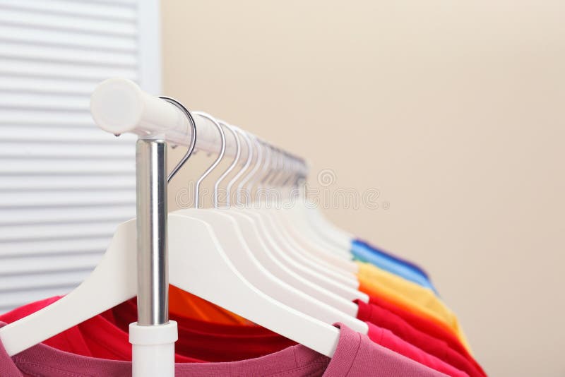 Rack with Bright Clothes in Room Stock Image - Image of grade, cotton ...