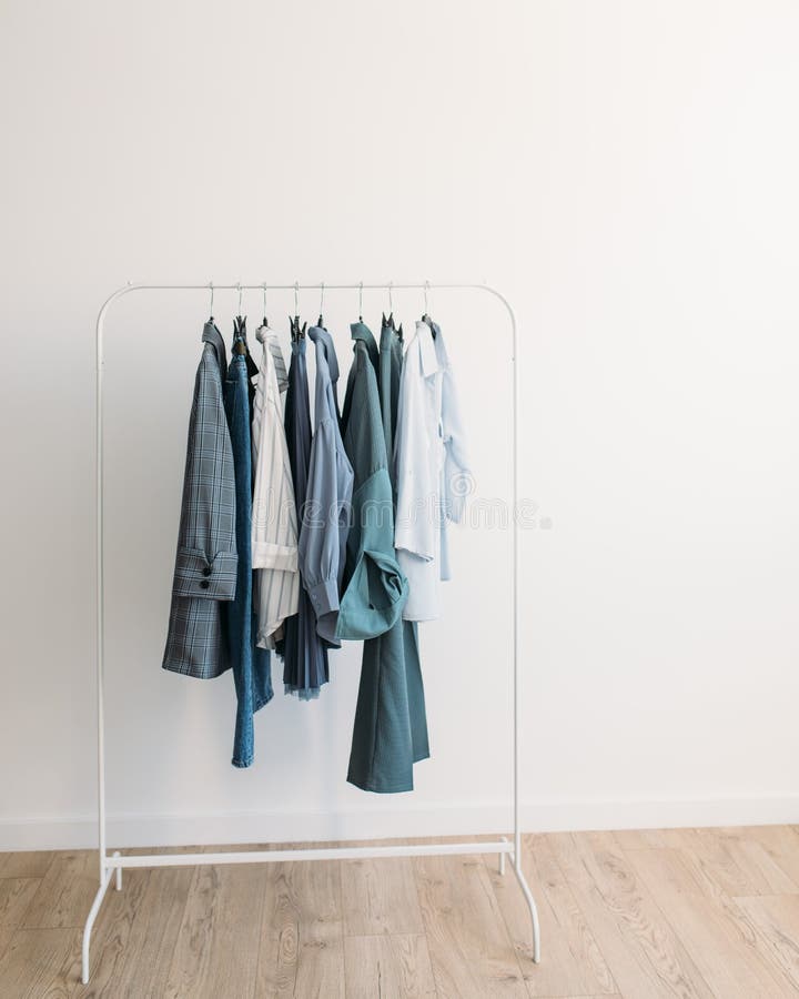 Rack with Capsule Clothes in Blue Colors Stock Image - Image of rack ...