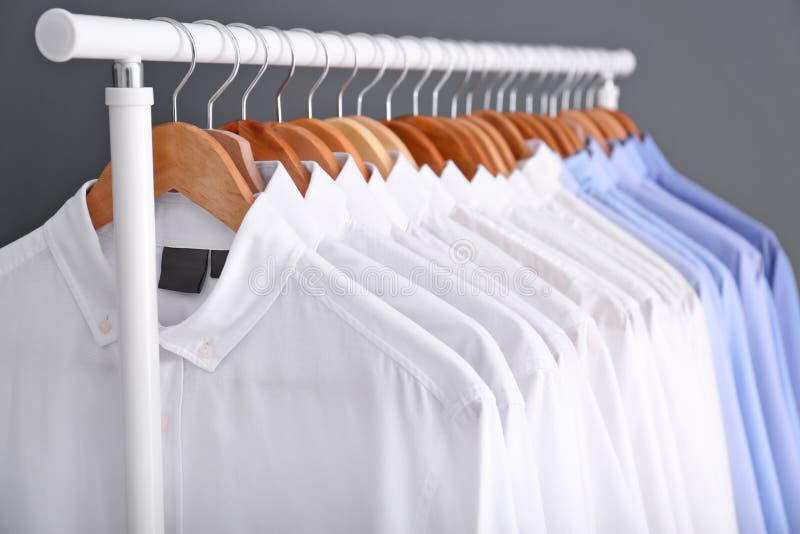 Rack with Clean Clothes on Hangers Stock Photo - Image of garment ...