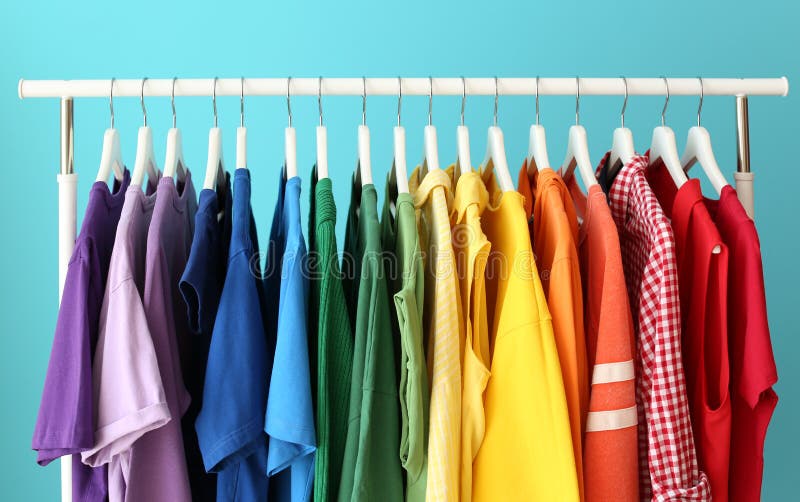 Rack with Rainbow Clothes on Color Background Stock Image - Image of ...