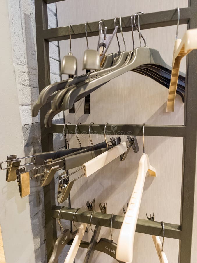 A Rack of Clothes Hangers Hanging on a Wall in a Closet Stock Image ...