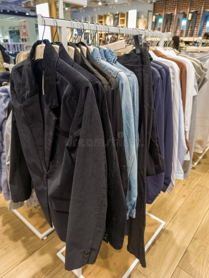 A Rack of Clothes Hanging on a Rack in a Clothing Store Stock Image ...