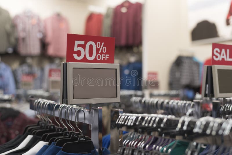 Rack of Clothes with 50 Sale Sign Above Stock Image - Image of ...