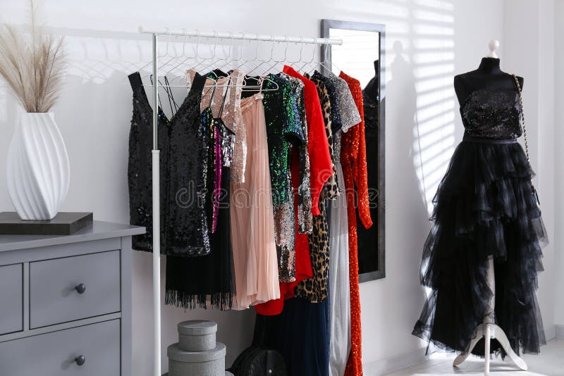 Rack with Collection of Beautiful Festive Clothes in Stylish Room ...
