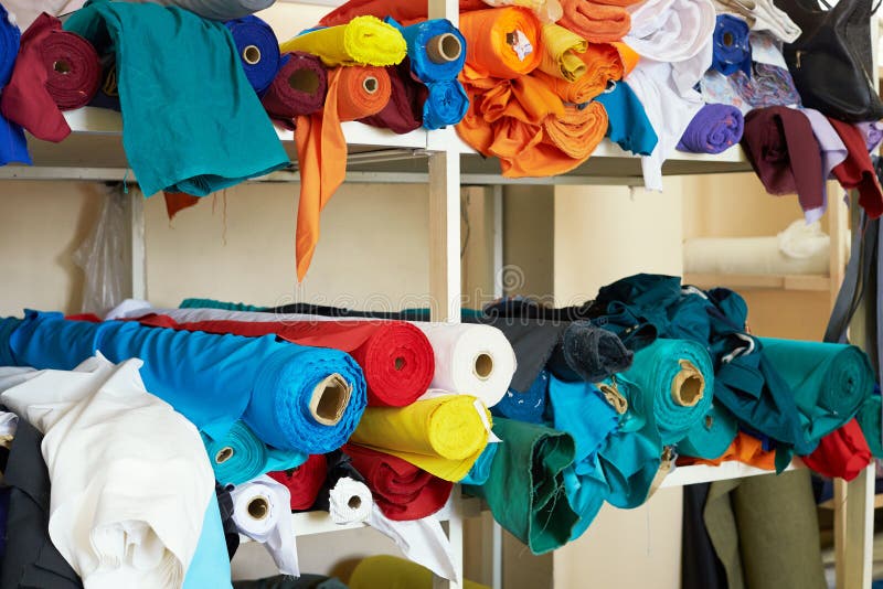 A Rack with Different Colored Fabrics in the Sewing Workshop at Stock ...