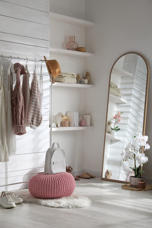 Rack with Stylish Clothes, Shoes and Decorative Elements in Dressing ...