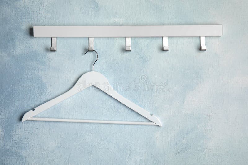 Rack with Empty Clothes Hanger on Color Wall. Wardrobe Accessory Stock ...