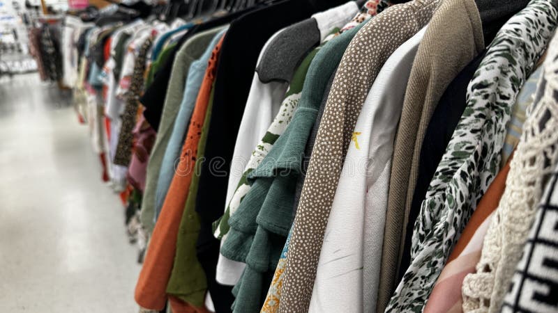 A Rack Filled with Various Clothing Items in Different Colors and ...