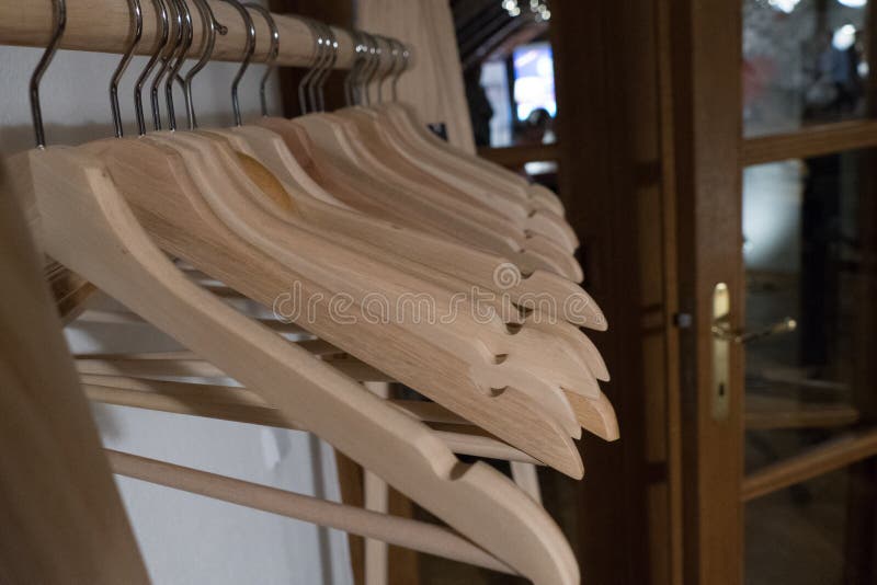 Rack Full of Empty Wooden Coathangers Stock Photo - Image of rack, coat ...
