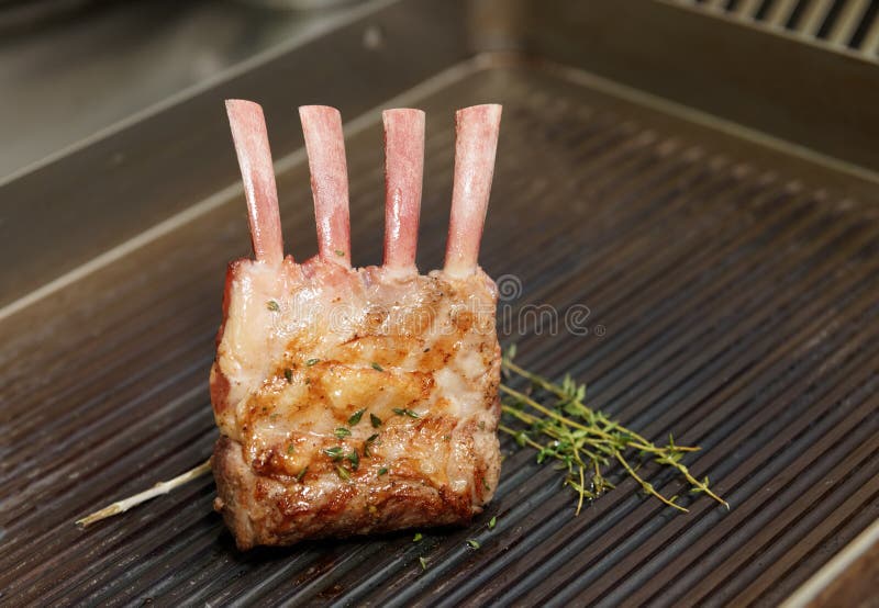 Rack of lamb on grill stock photo. Image of healthy, steel - 34924456
