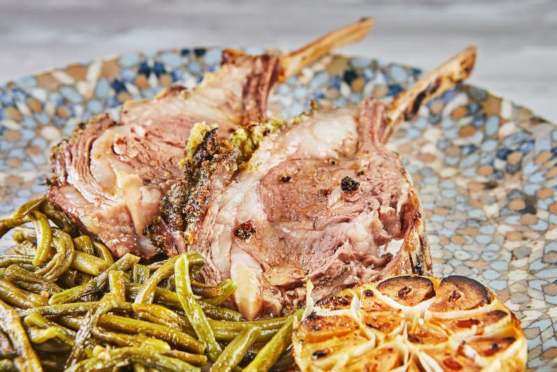 Rack of Lamb Medium Rare, Baked with Green Beans and Garlic Stock Image ...