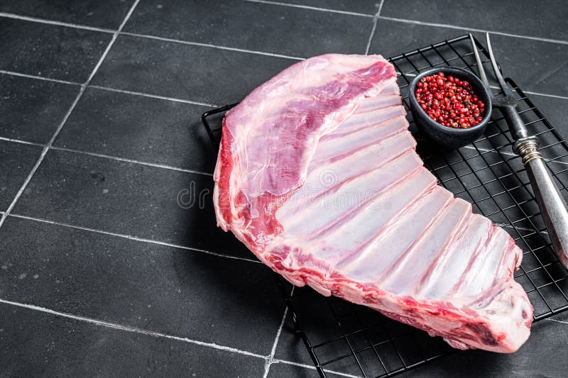 Rack of Lamb, Raw Mutton Ribs on Kitchen Table with Spices. Black ...