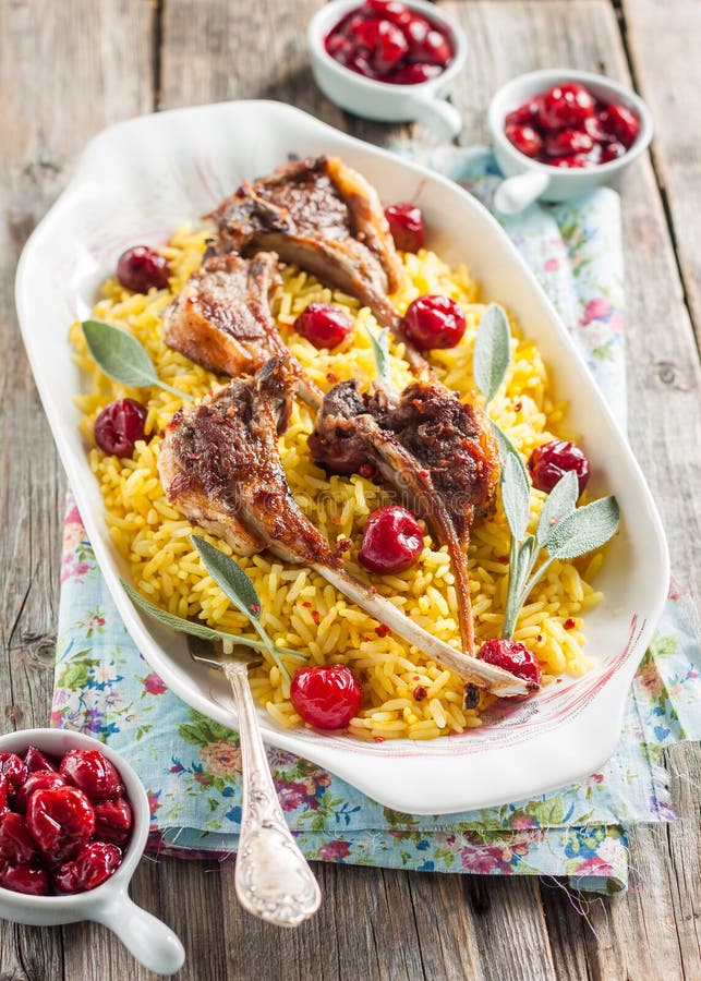 Rack of Lamb with Rice and Cherry Sauce Stock Photo - Image of ...