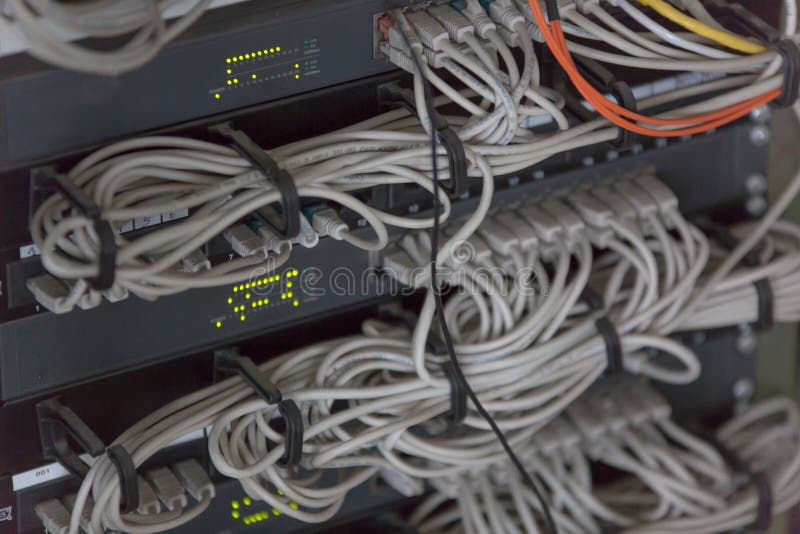 Rack Mounted Servers in a Server Room, Man Work with Lan or Network ...