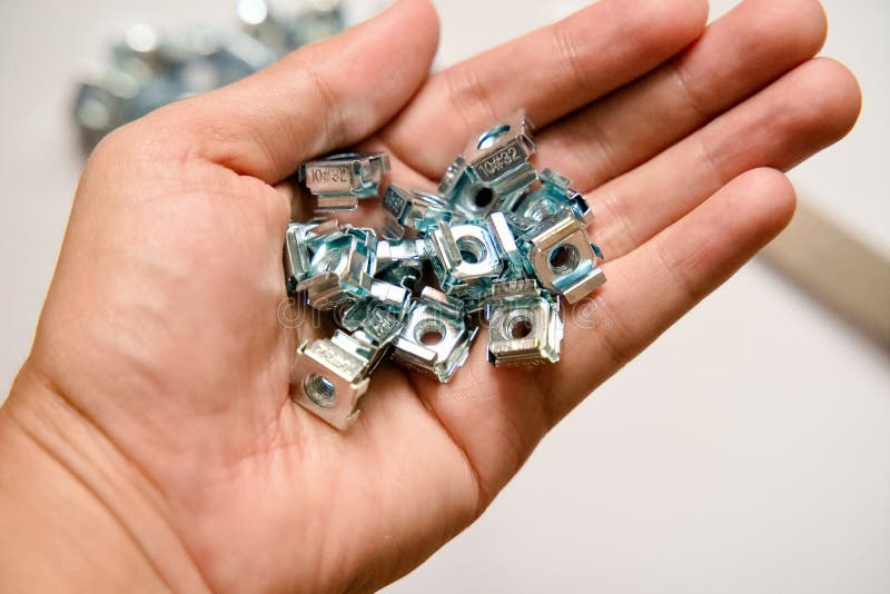 Rack Mounting Equipment Cage Nuts with Rack Studs . Stock Image - Image ...