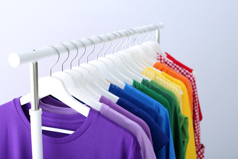 Rack with Rainbow Clothes on Color Background Stock Image - Image of ...