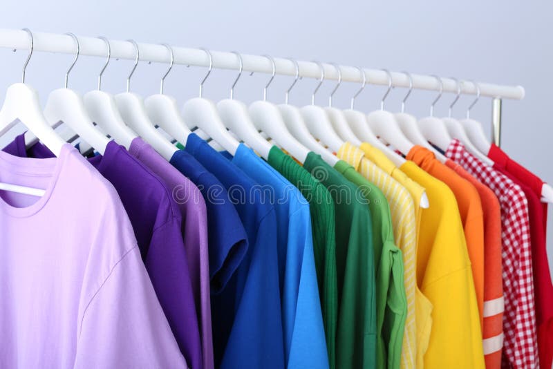 Rack with Rainbow Clothes on Color Background Stock Image - Image of ...