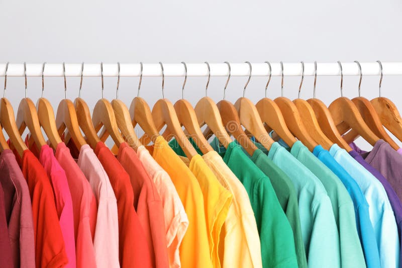 Rack with Rainbow Clothes on Color Background Stock Image - Image of ...