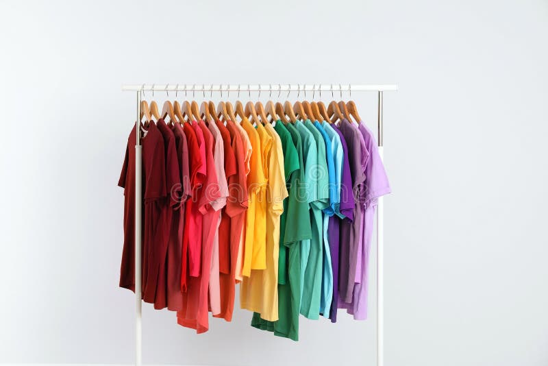 Rack with Rainbow Clothes on Color Background Stock Image - Image of ...