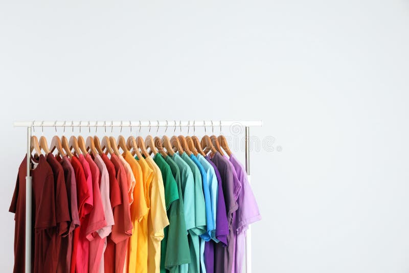 Rack with Rainbow Clothes on Color Background Stock Image - Image of ...