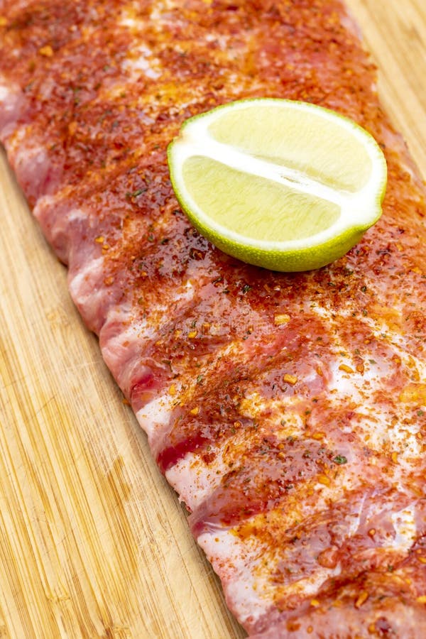 A Rack of Raw Baby Back Rib Marinated with Herbs and Spices, and Fresh ...