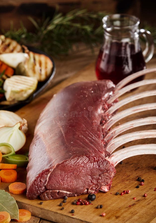 Rack of Ribs on Chopping Board with Condiments Stock Photo - Image of ...