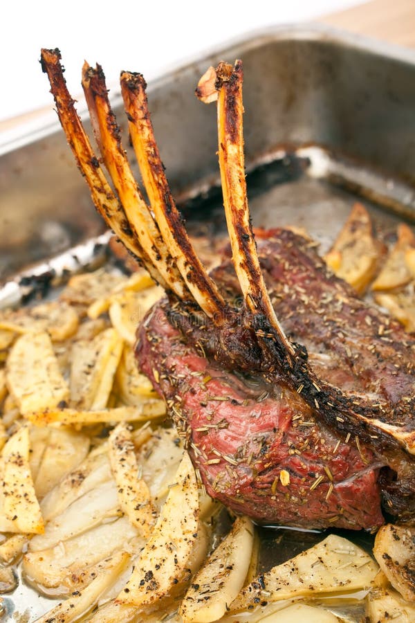 Rack of Ribs with Potatoes stock image. Image of prime - 40858913