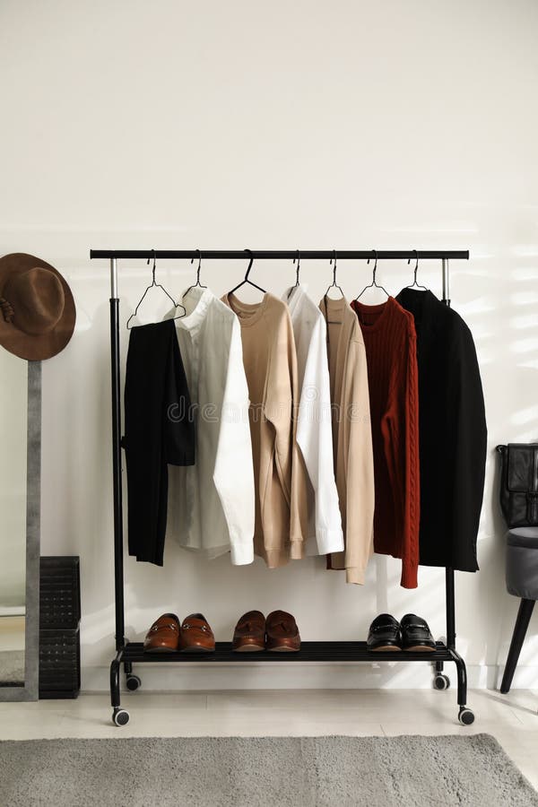 Rack with Stylish Men`s Clothes Indoors. Interior Design Stock Photo ...