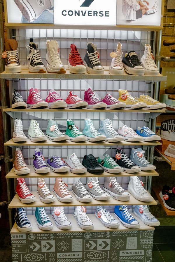 Rack in a Supermarket with Converse Shoes of Different Colors and Sizes ...