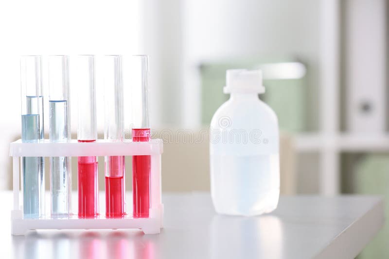 Rack with Test Tubes and Bottle on Table in Laboratory. Stock Image ...
