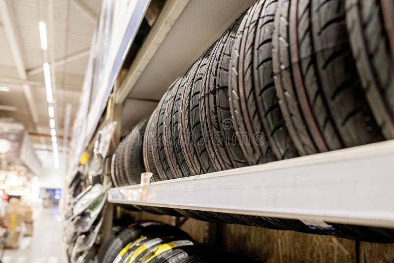 Rack with Variety of Car Tires in Automobile Store Stock Photo - Image ...