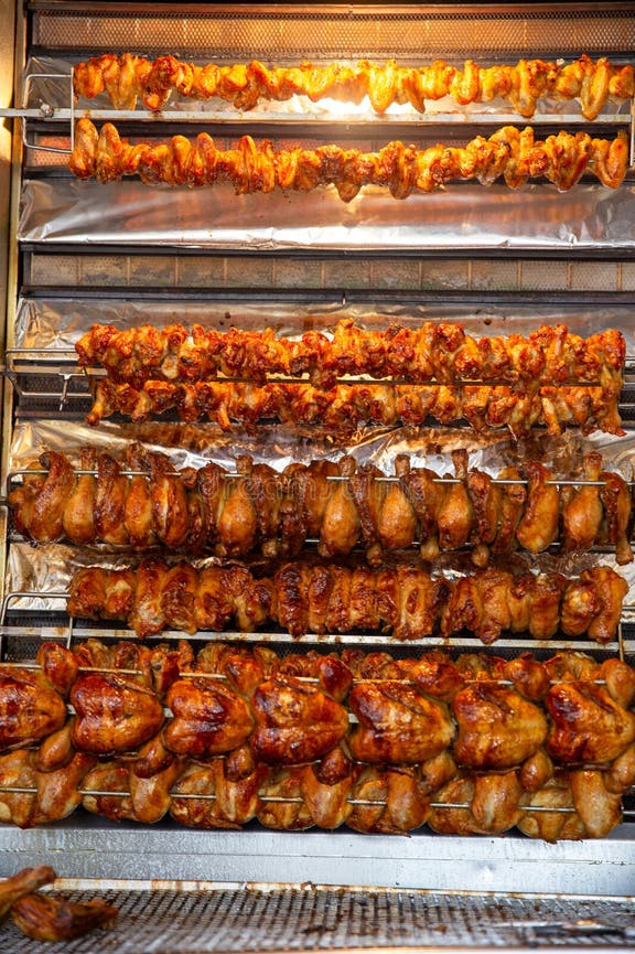 Racks of Chicken Roasting stock image. Image of bunched - 285887599